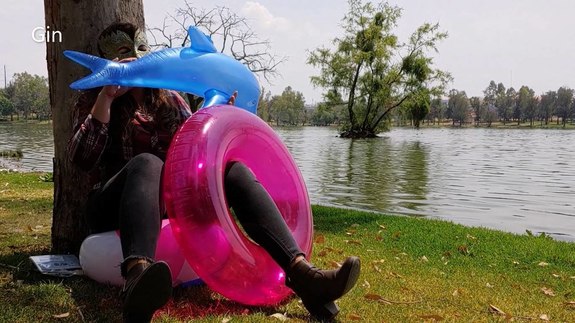 Blowing up small inflatables in the park by Gin - julielooner. This is ...