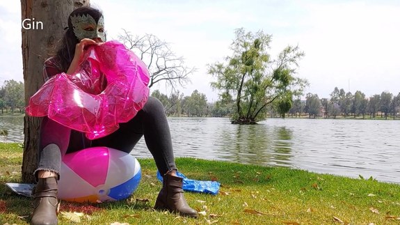 Blowing up small inflatables in the park by Gin - julielooner. This is ...