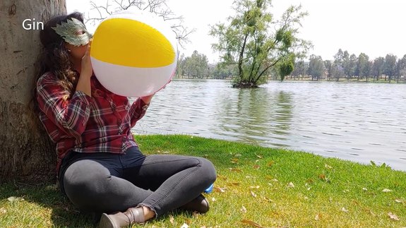 Blowing up small inflatables in the park by Gin - julielooner. This is ...