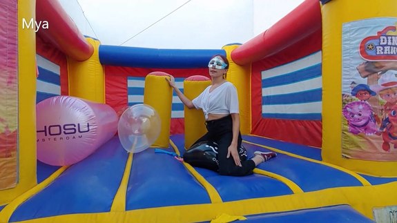 Mya ride to pop balloons in the inflatable castle!! - julielooner. Mya ...