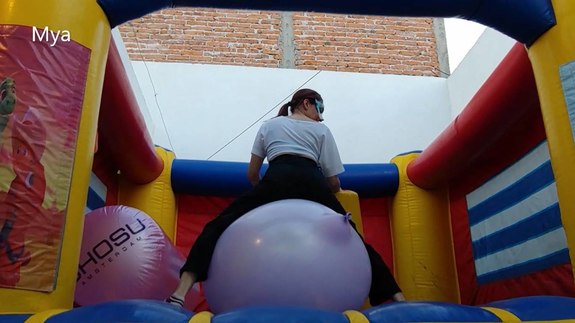 Mya ride to pop balloons in the inflatable castle!! - julielooner. Mya ...